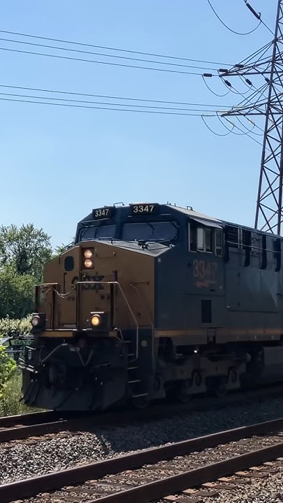 CSX 3347 ET44AC leads CSX I032 through Bound Brook, NJ with a Mac trailing and a friendly crew ...