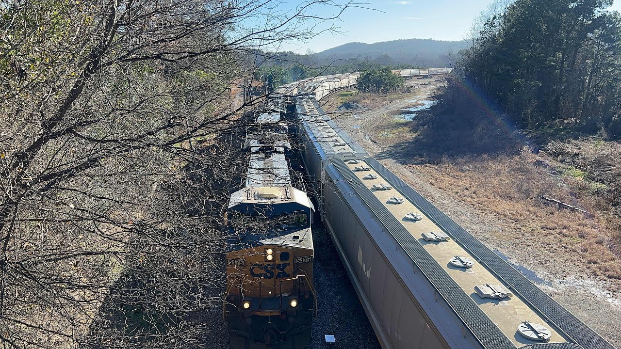 Aerial view of CSX 5475, CSX 3449 & CSX 170 leaving the mountains of ...