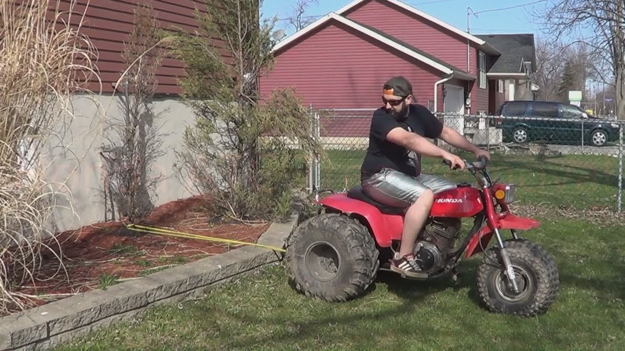 Pulling out Trees with Honda ATC - YouTube