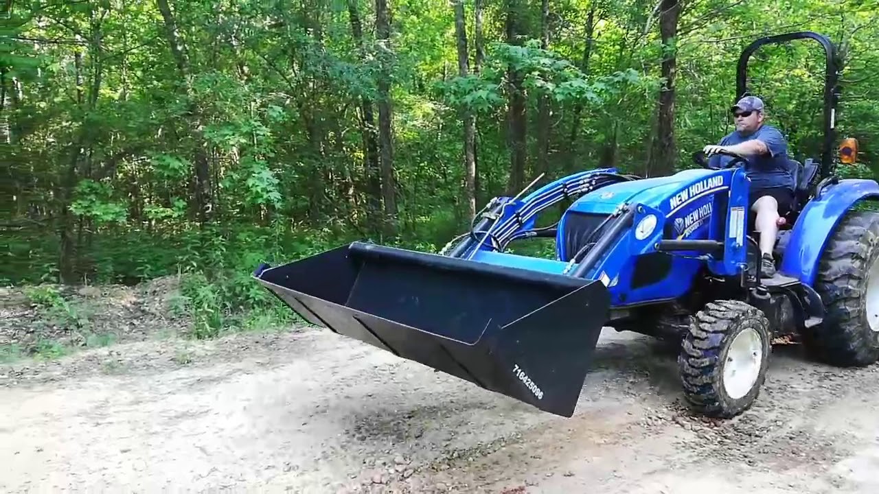 New Holland Boomer gets to do some road work - YouTube