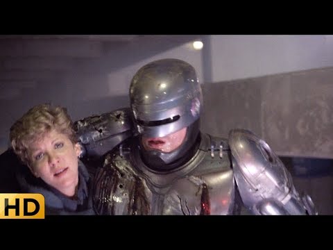 Льюис подбирает раненого Робокопа. Робокоп 1987.