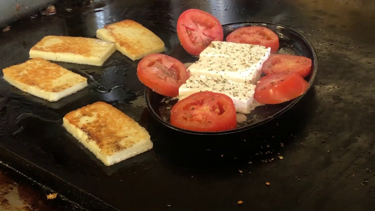 Papa Cristo cooks with Greek cheese at Papa Cristo's Greek Grill in Los ...