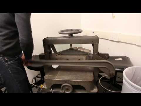 04 Trimming the Book Block on the Guillotine - YouTube