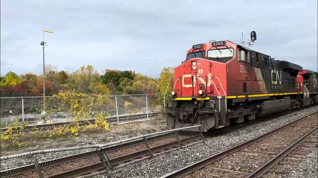 GO Transit MP40PH-3C 608 and CN Rail GEVO 2302 at Aldershot GO - YouTube