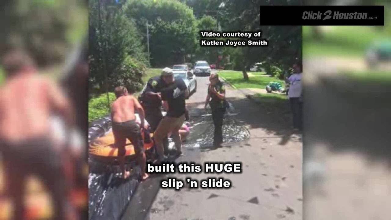 VIDEO: Police officers called to water slide join slip 'n' slide party ...