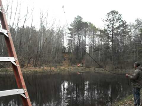 4 year old riding 320 foot zip line over pond - YouTube