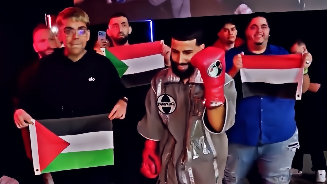 SNEAKO and N3on walk out with Adam Saleh at BRANDRISK Boxing holding ...