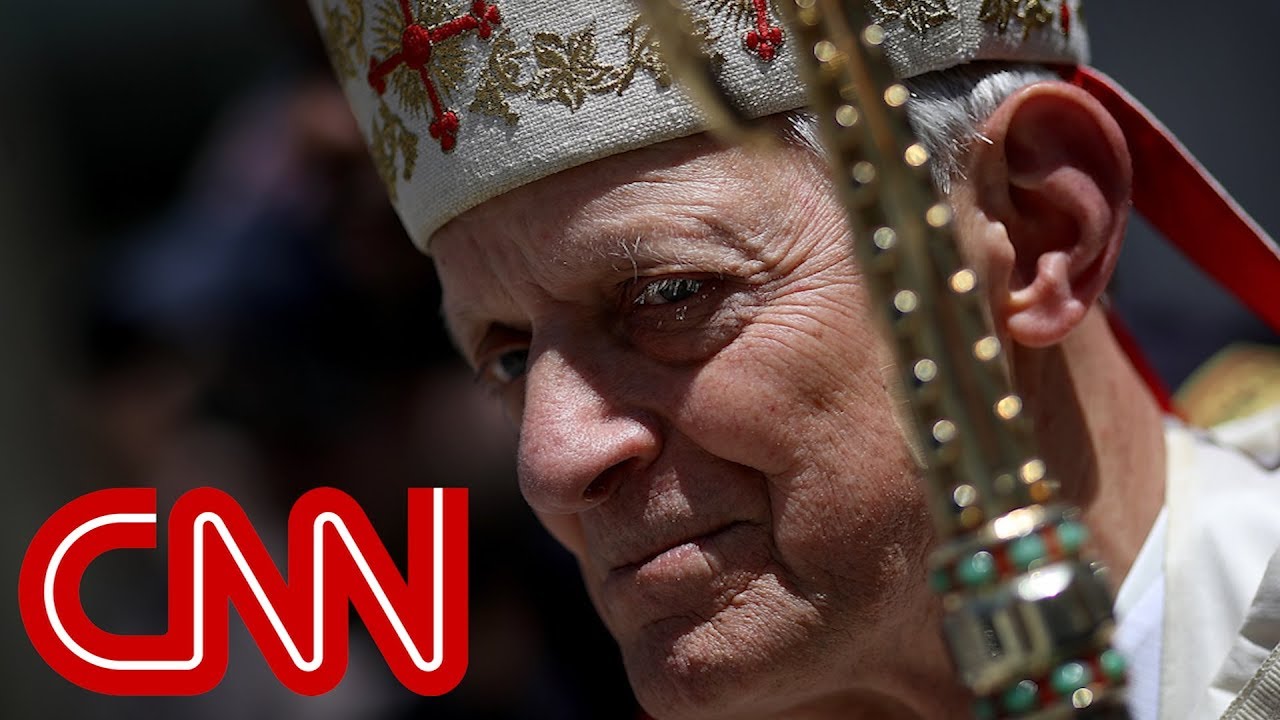 Catholic yells 'shame on you' to Cardinal Wuerl at church - YouTube