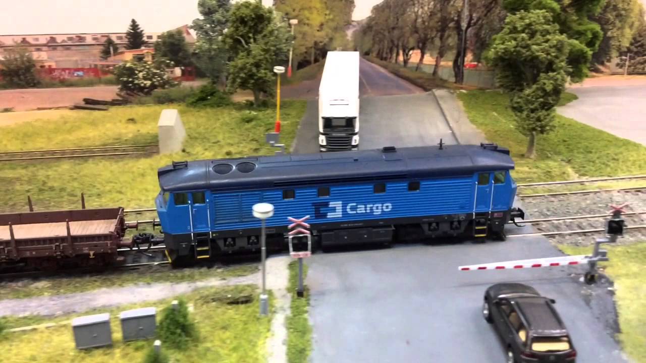 A Bardotka in the newer Czech Cargo livery departs with a freight train ...