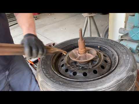 Using the old tire changer to removing a tire - YouTube