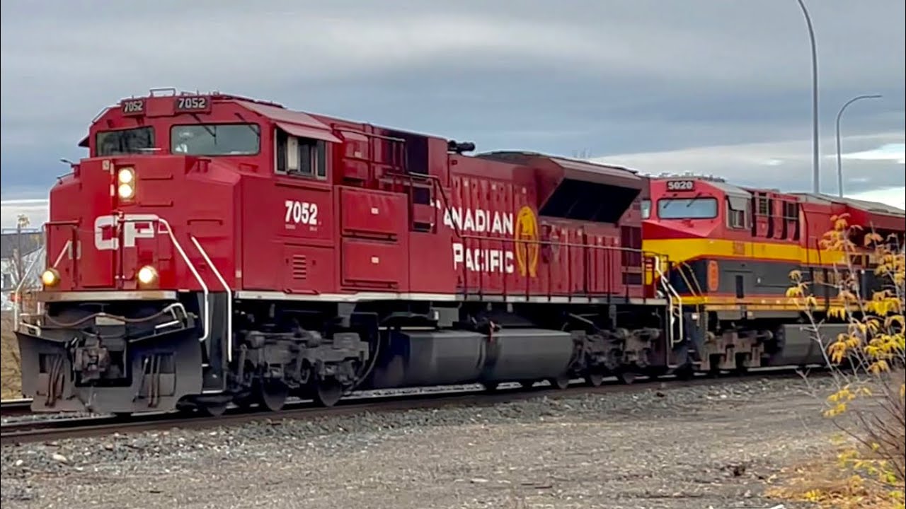 CP SD70ACU leading and KCS ET44AC at front CP Freight train leaving ...