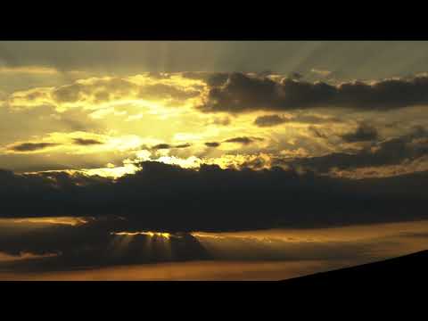 Amazing Movement of Yellow Poisonous Clouds on a Blue Sky at a Fading Sunset