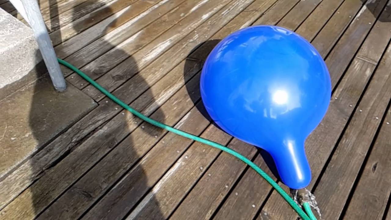 Giant ballon filled with water in slow motion - YouTube