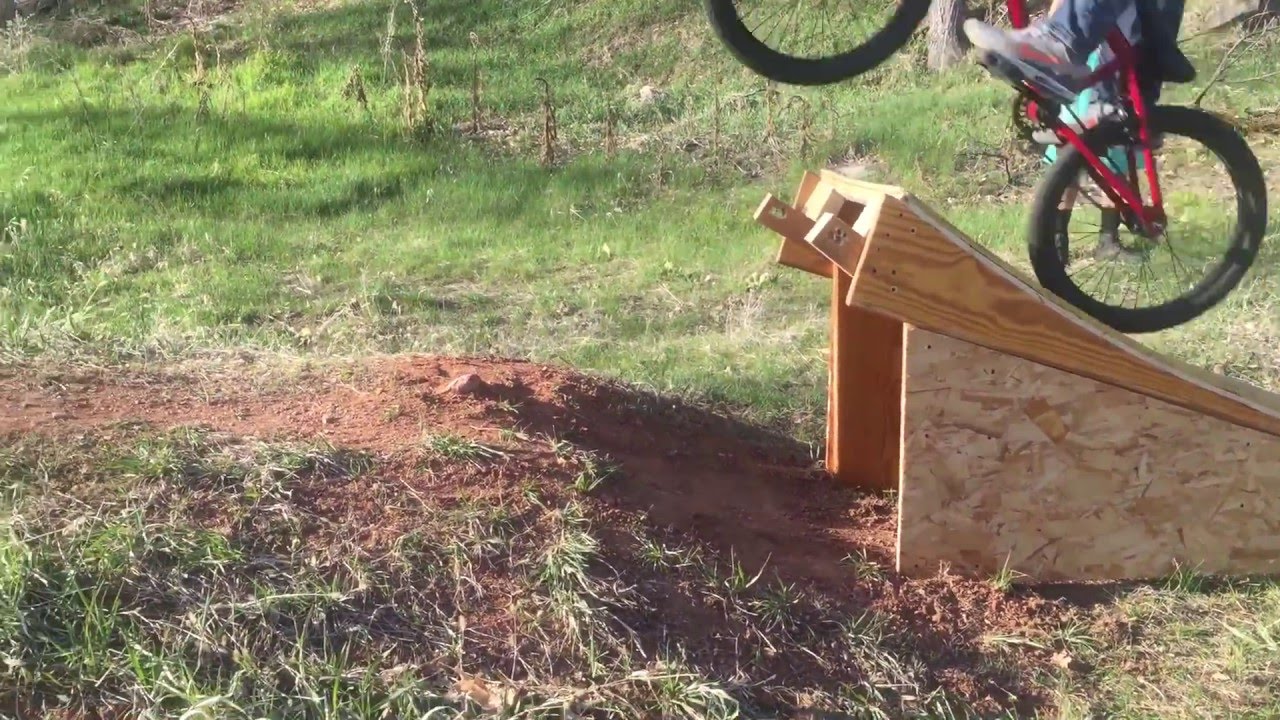 Jumping on The new ramp at the dirt jumps - YouTube
