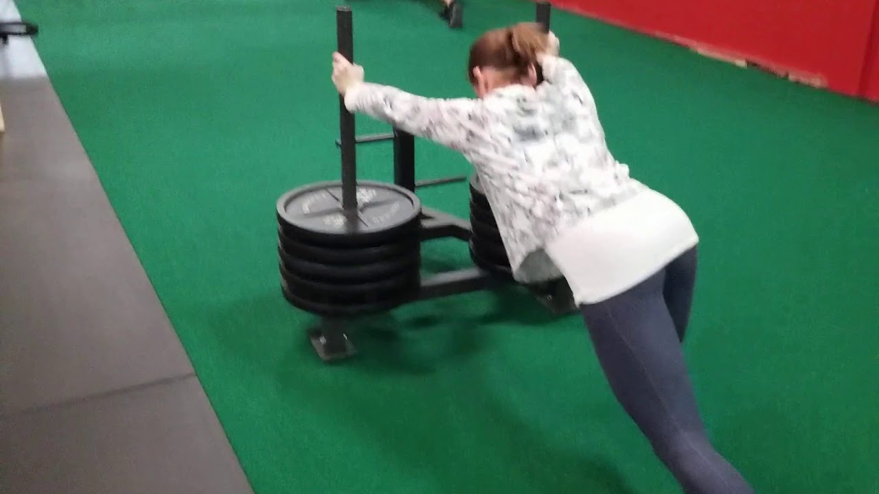 625# sled push by our female sled leader - YouTube