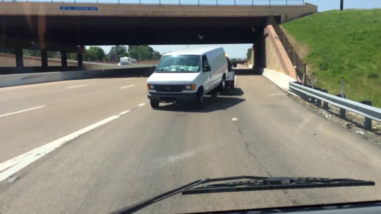 Tow truck pulling ford van sideways - YouTube