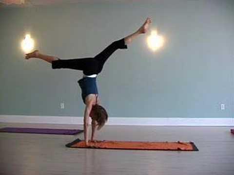 Yoga teachers practice handstand and backbend variations - YouTube