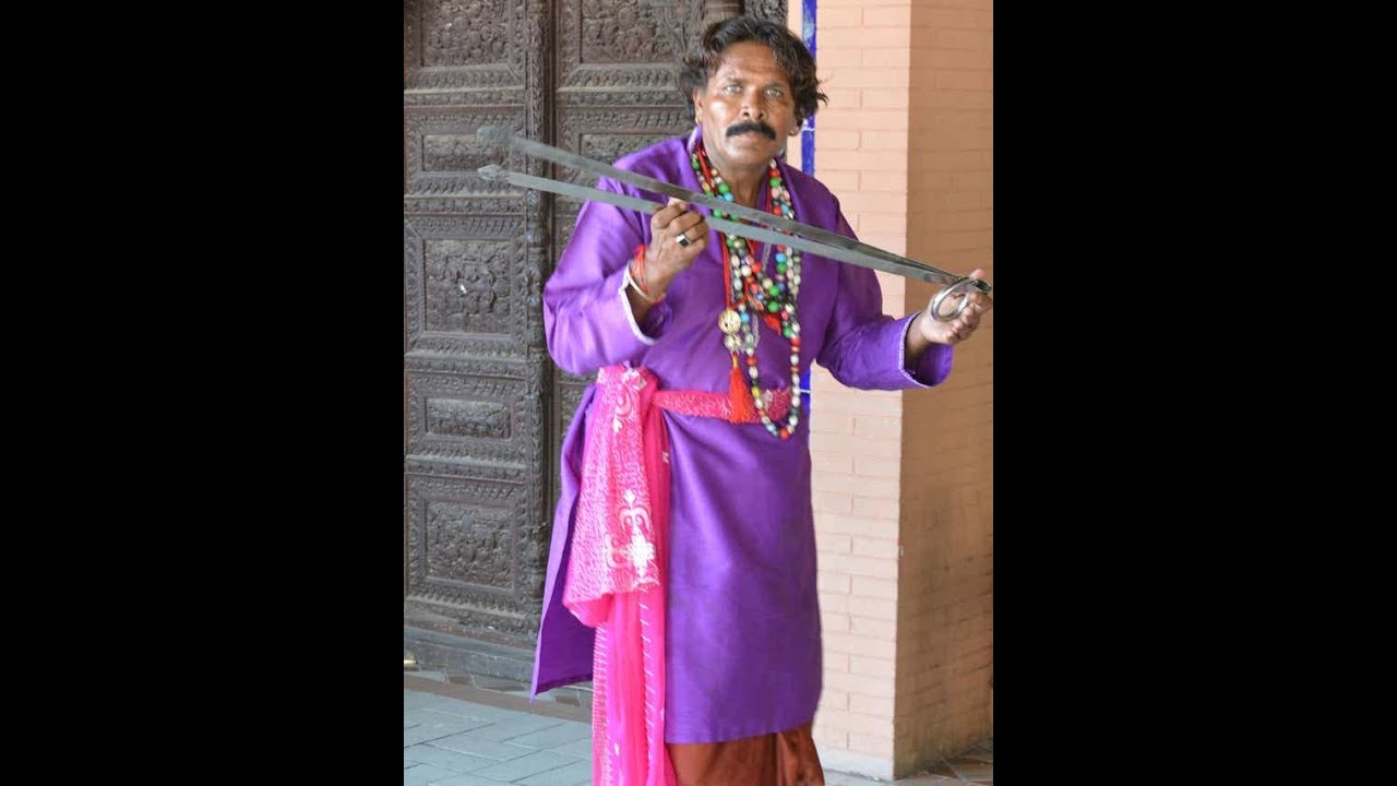 Famous Pakistani Folk singer singing traditional Folk song with holding ...