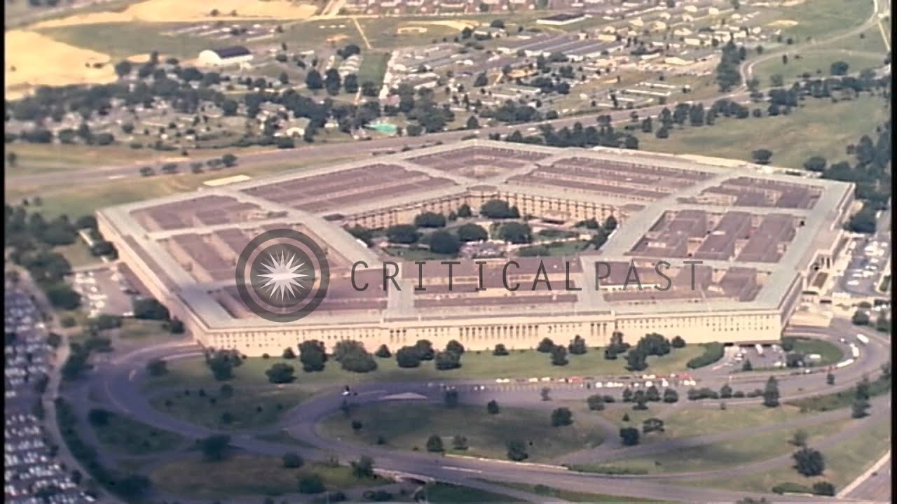 Aerial view of the Pentagon, the Potomac River and trees and fields ...