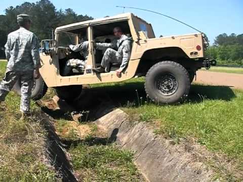 Driving a HUMVEE through a ditch - YouTube