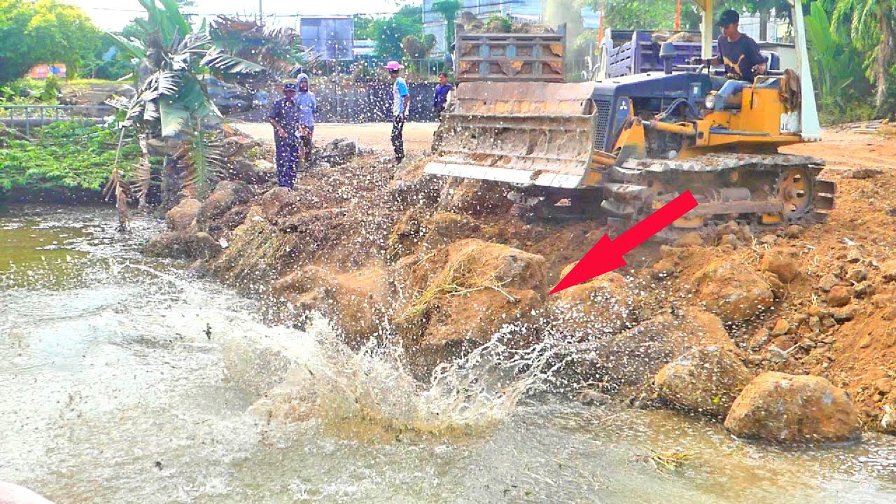 Amazing action!! Dozer expert pushes large rocks into water for the ...