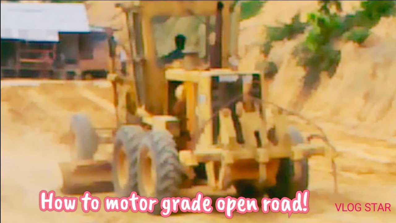 How motorgrader grading open road in the local workers accommodations ...