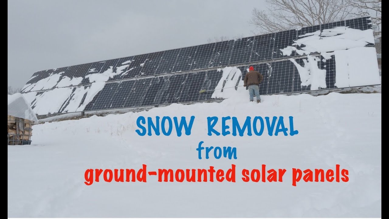 Snow removal from ground-mounted solar panels - YouTube