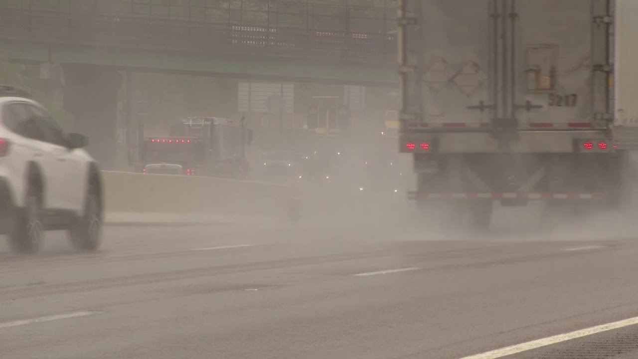 Holiday weekend traffic slogging through nor'easter - YouTube