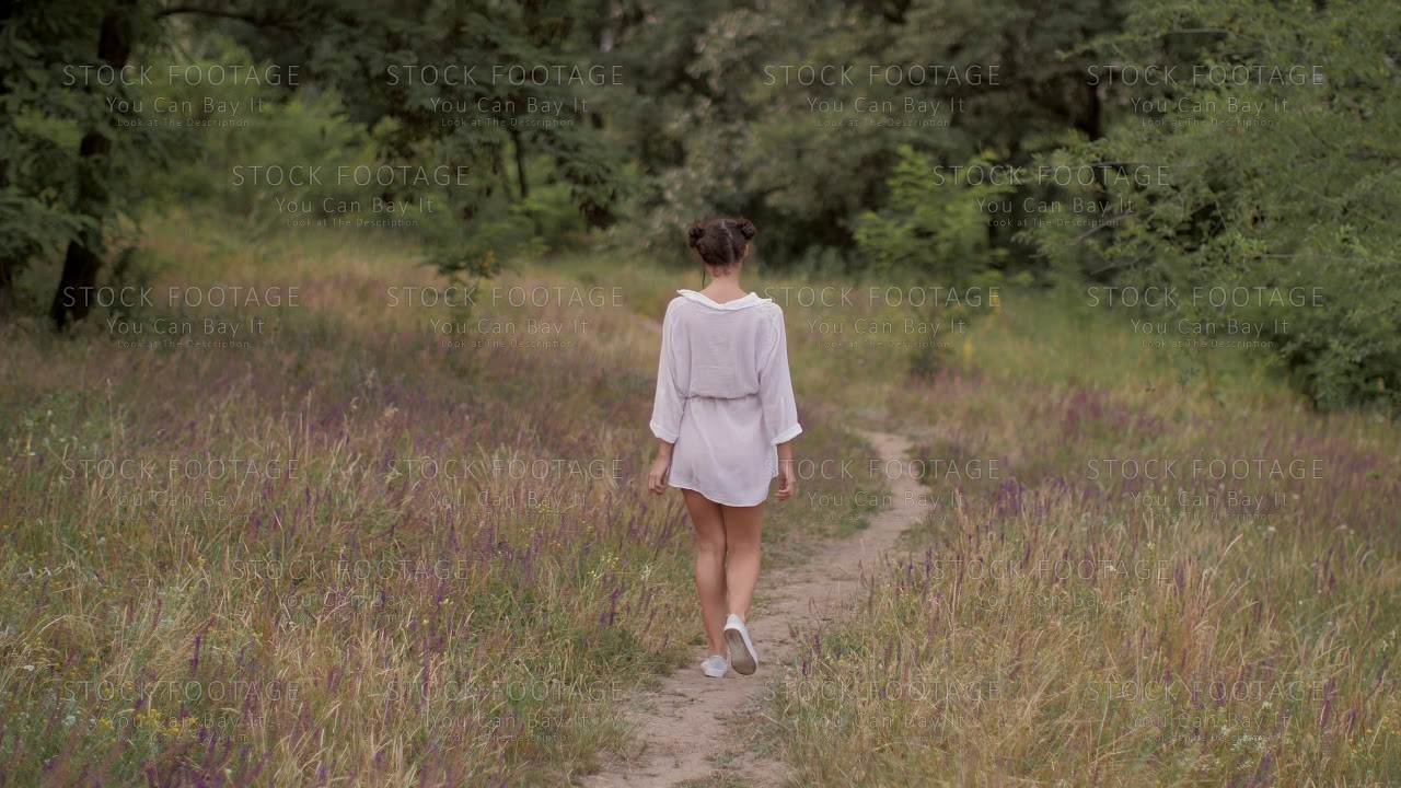 Beautiful woman walking outdoors on nature - YouTube