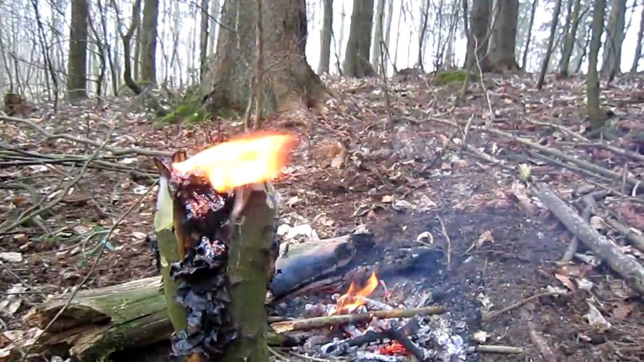 Rainy day making a torch from pine resin - YouTube