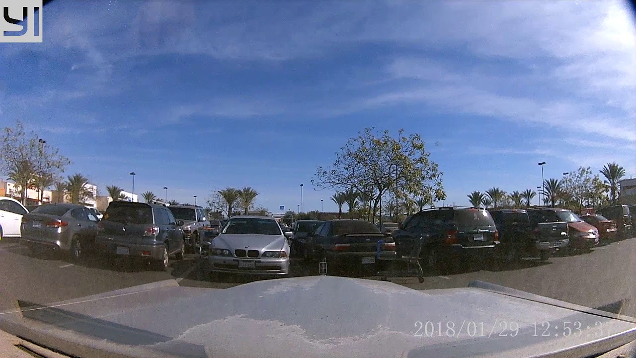 Reversing cars bump each other in parking lot - YouTube