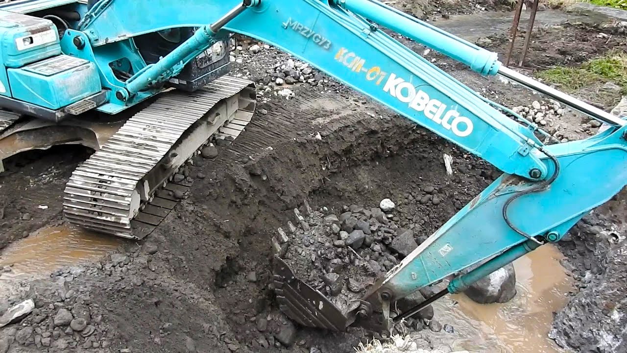 Kobelco Excavator Digging Bridge Foundation Hole - YouTube