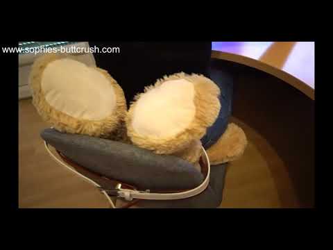 Big Teddy as a seat cushion in the office