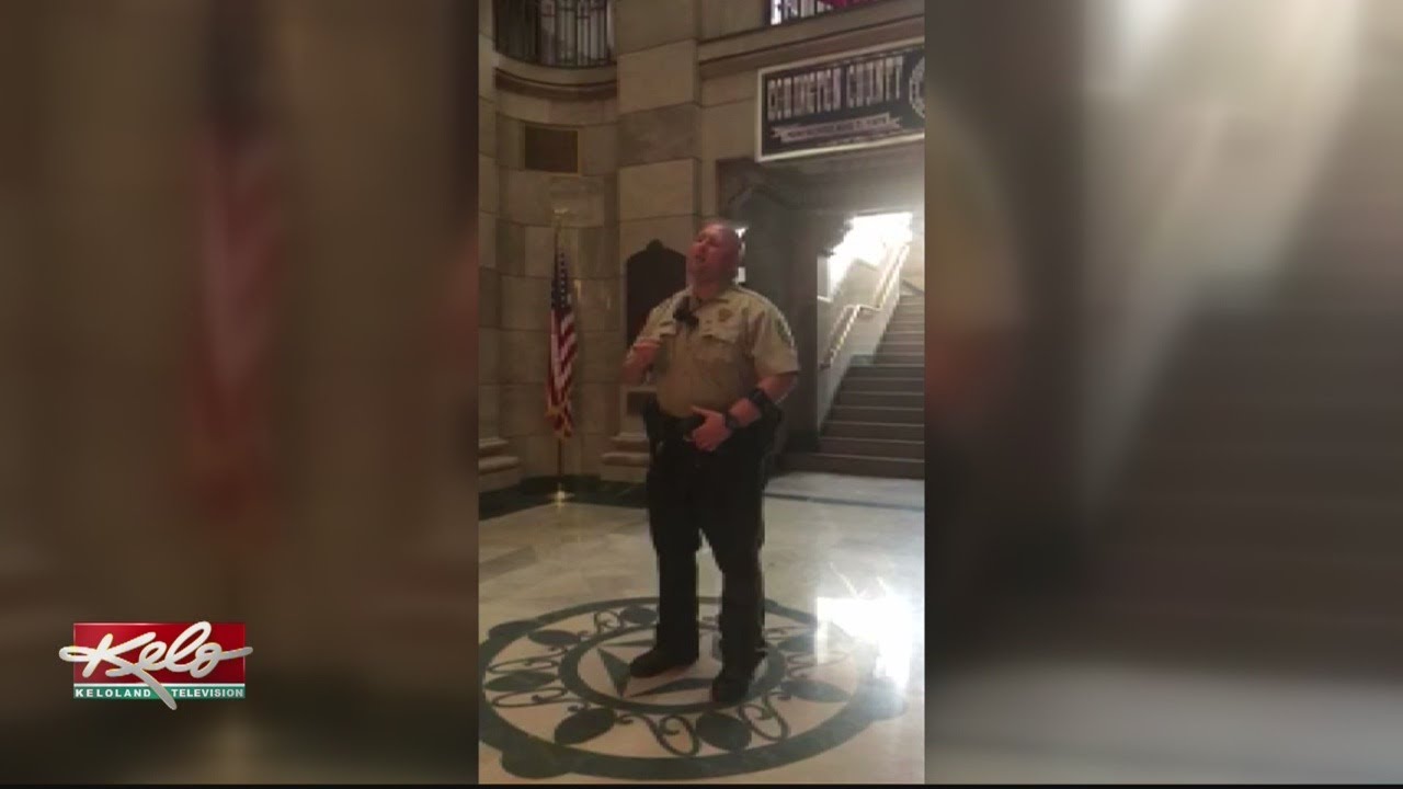 Codington County Deputy Sings National Anthem In Courthouse - YouTube