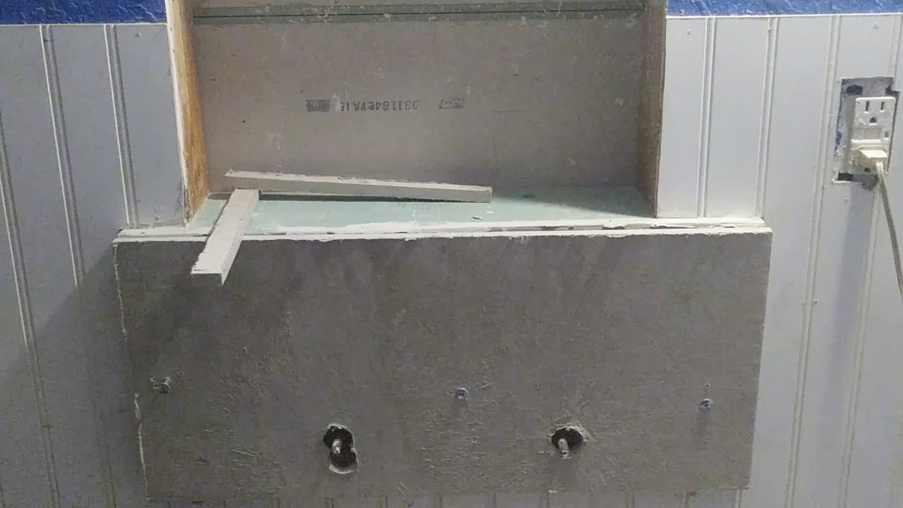 Installing leveling and plumbing backer board for a bathroom backsplash ...