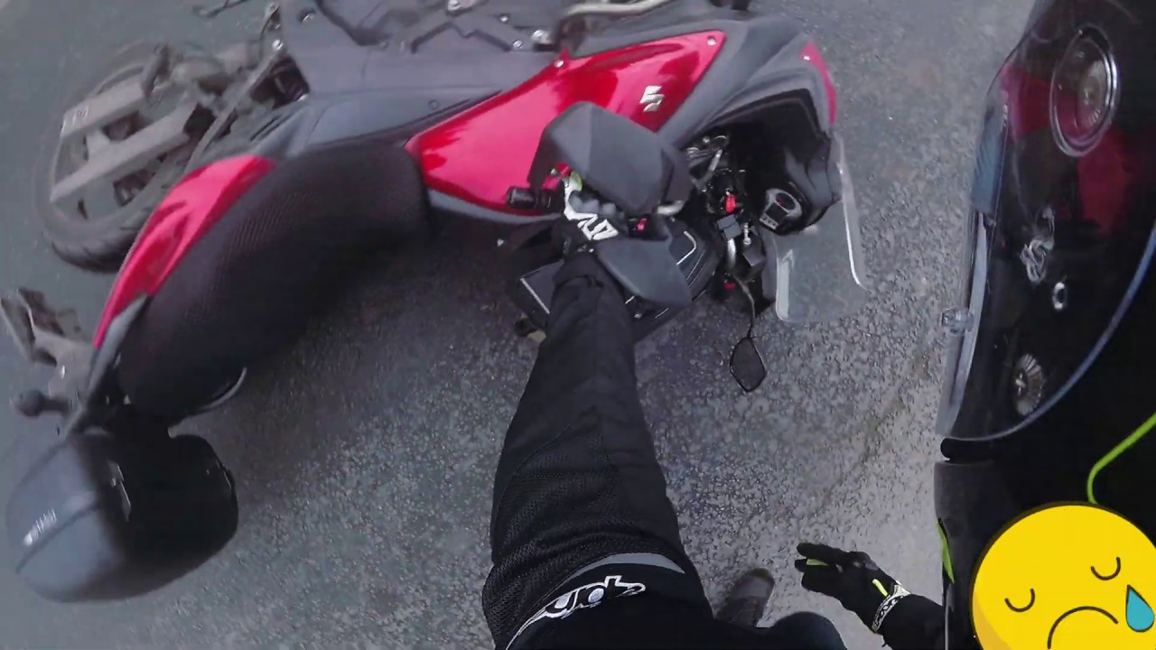 Motorcycle slipped on wet road - YouTube