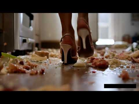 Cat walk in high heels on crushed food