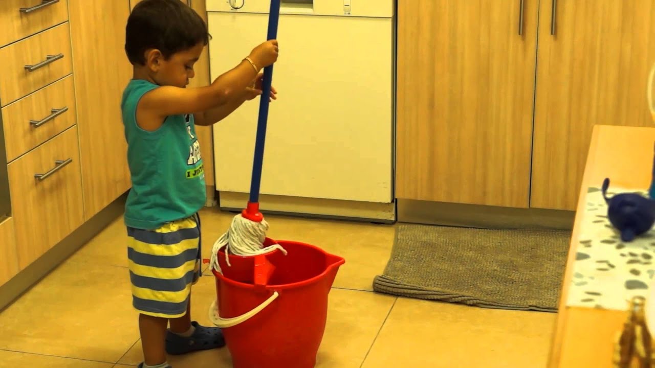 Kid Mopping The Floor