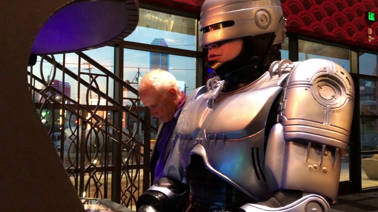 Robocop (Peter Weller) playing Robocop Pinball while Robocop plays ...