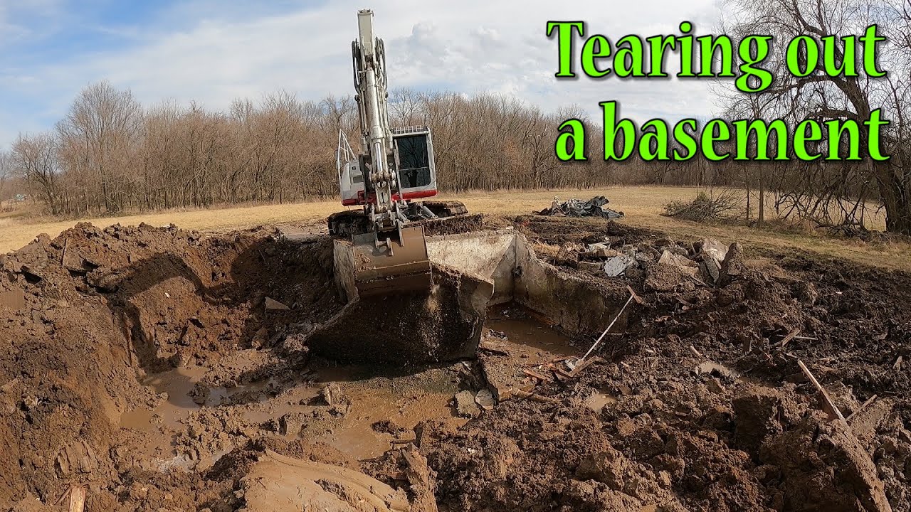 Tearing Out The Concrete Basement And Rough Grading - YouTube