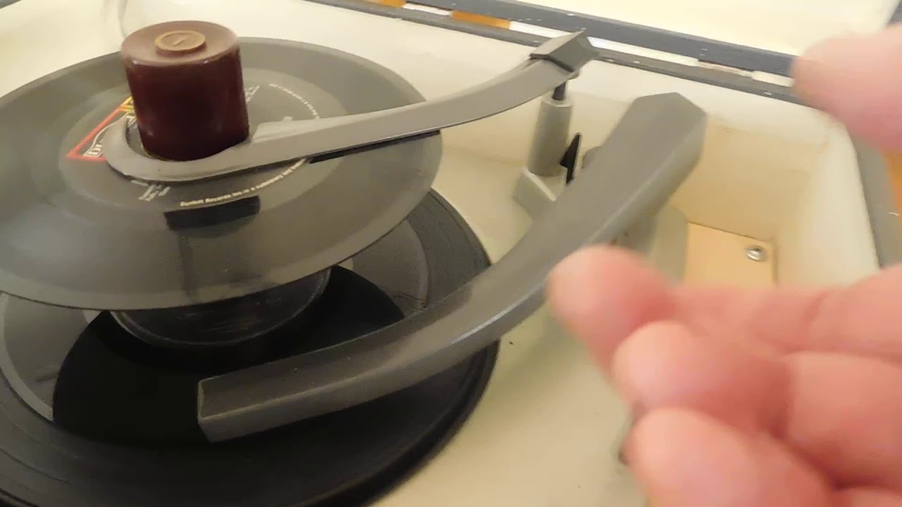 Columbia record player, Circa 1958 playing a couple 45 RPM records ...