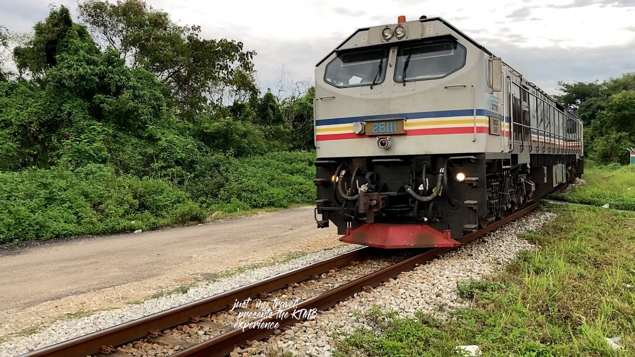 KTMB Class 26111 Tanjung Piai locomotive with container wagons and ...