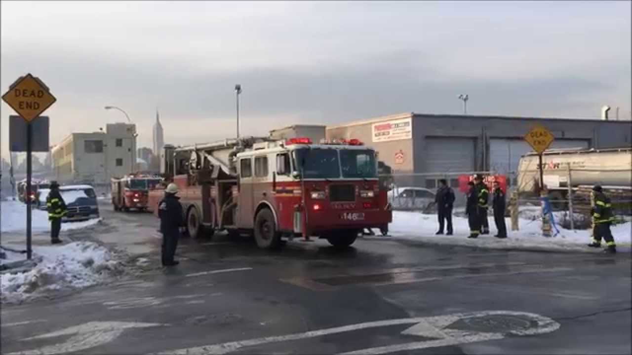 FDNY TOWER LADDER 146 TAKING UP AFTER SERVICE 7 ALARM WAREHOUSE FIRE IN ...