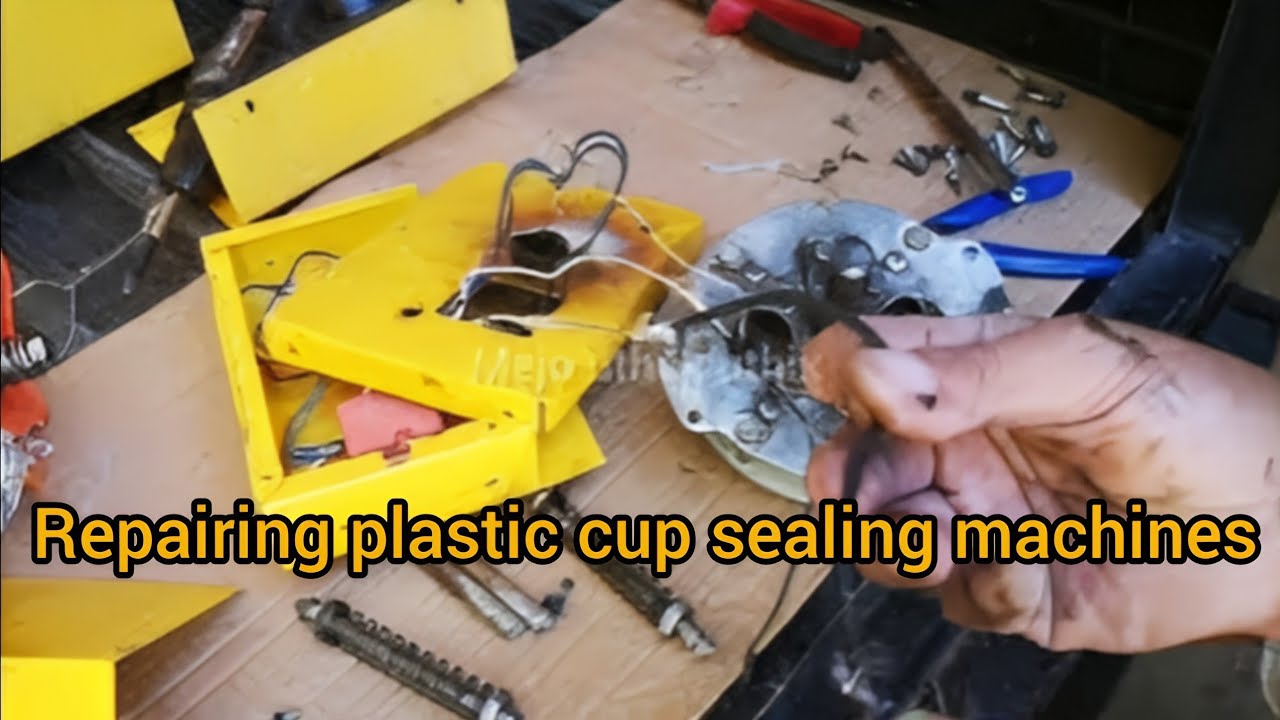 disassembling and repairing plastic cup sealing machines - YouTube