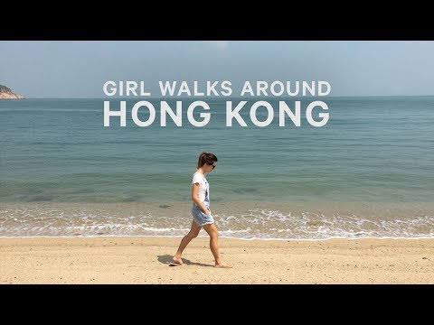 GIRL WALKS AROUND HONG KONG