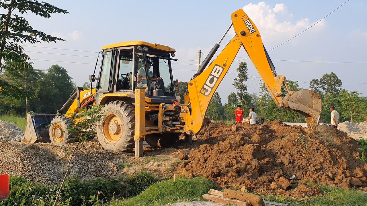 JCB Backhoe Making Drain in Village Road To Install Concrete Pipe - JCB ...