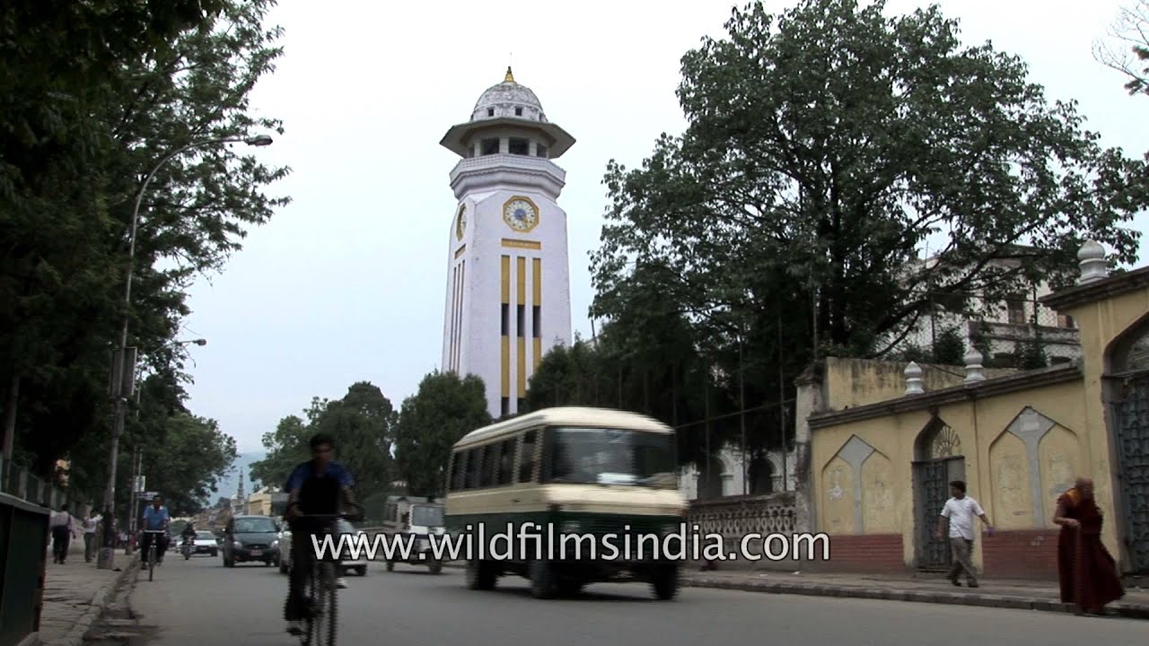 Busy traffic near the first public clock tower in Kathmandu city, Nepal ...