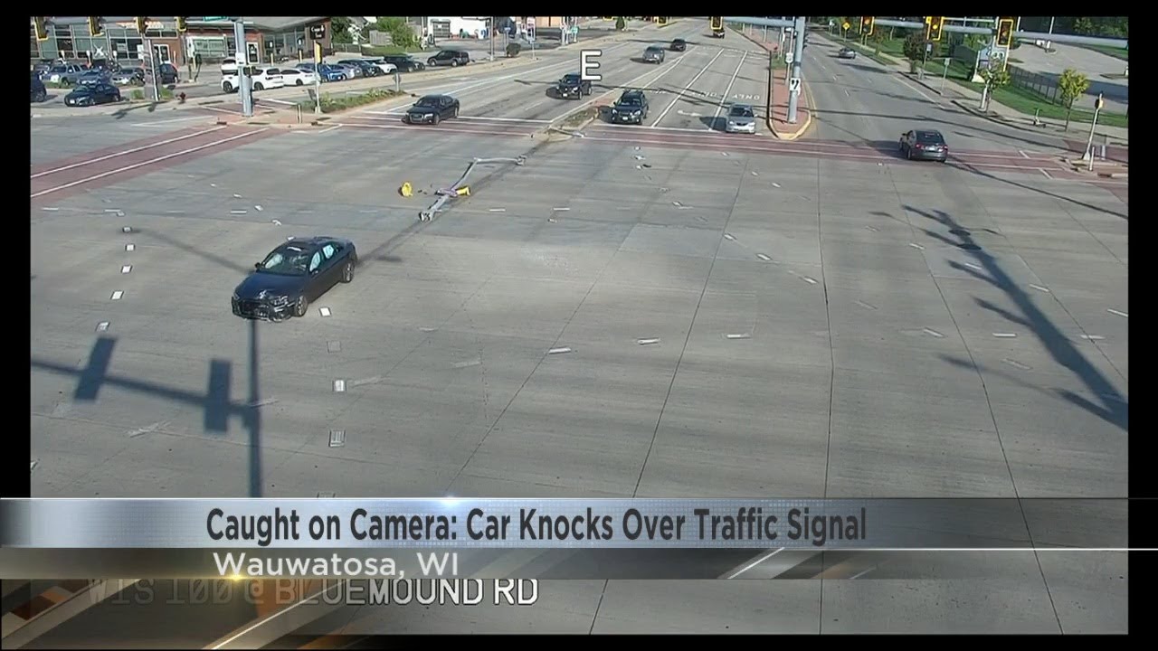Caught on camera: Car knocks over traffic signal - YouTube
