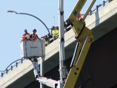 Raw: Two Rescued From Crane Hanging Off Bridge - YouTube