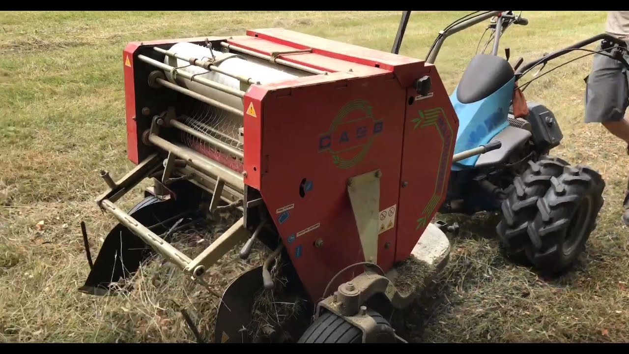 Traditional hay making with pedestrian tractor, hay bob and mini baler ...